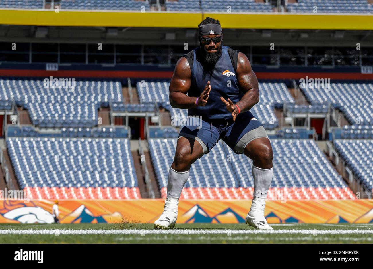 Denver Broncos offensive tackle Menelik Watson runs a drill before the ...