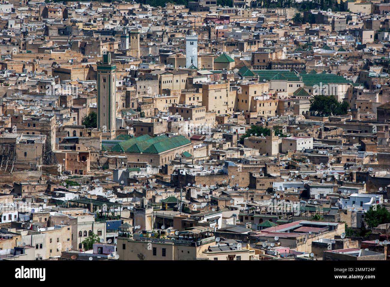 The green striped minaret of R'cif Mosque stands tall above the old ...