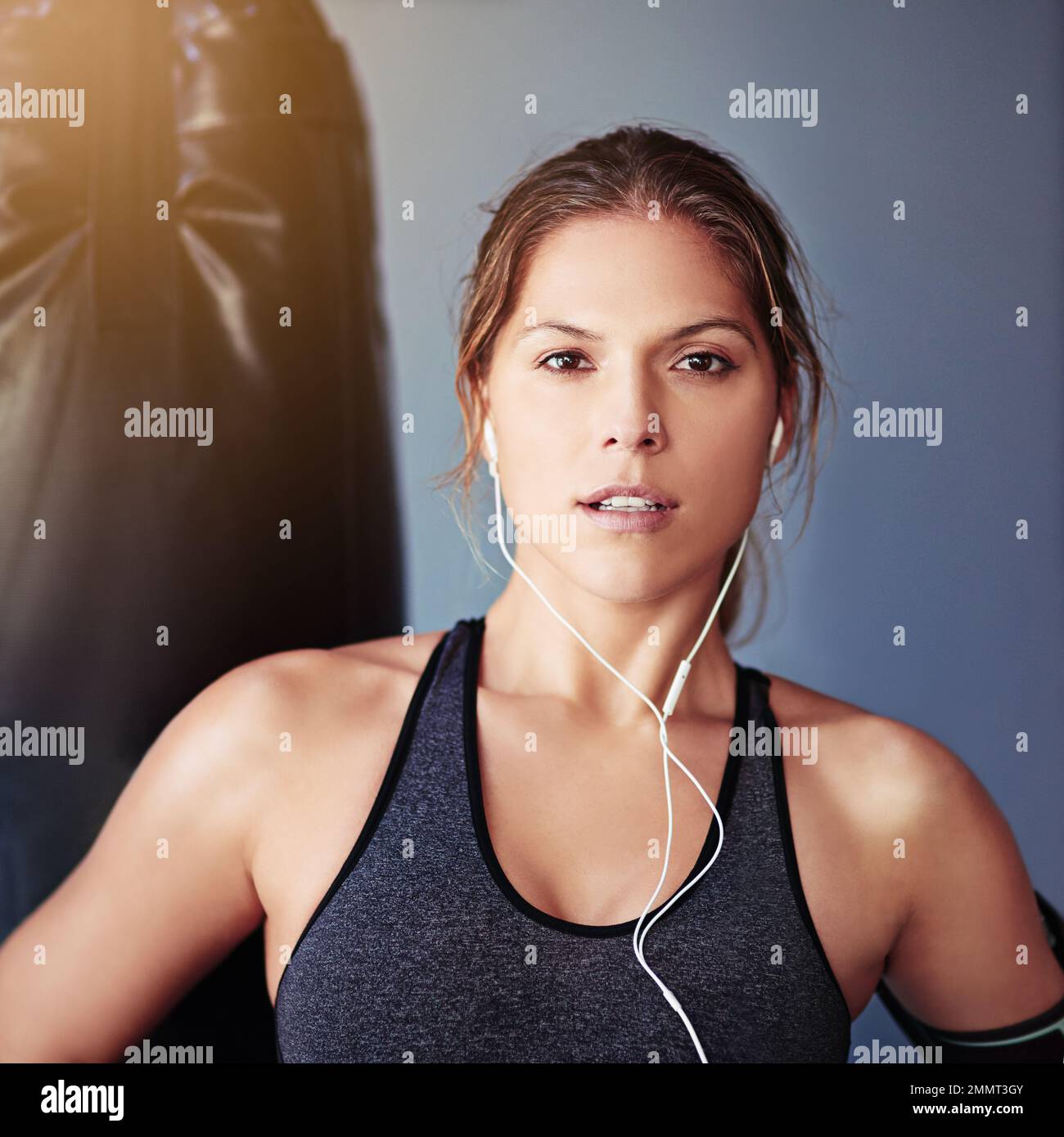 Winners train, losers complain. Cropped portrait of a female boxer ...