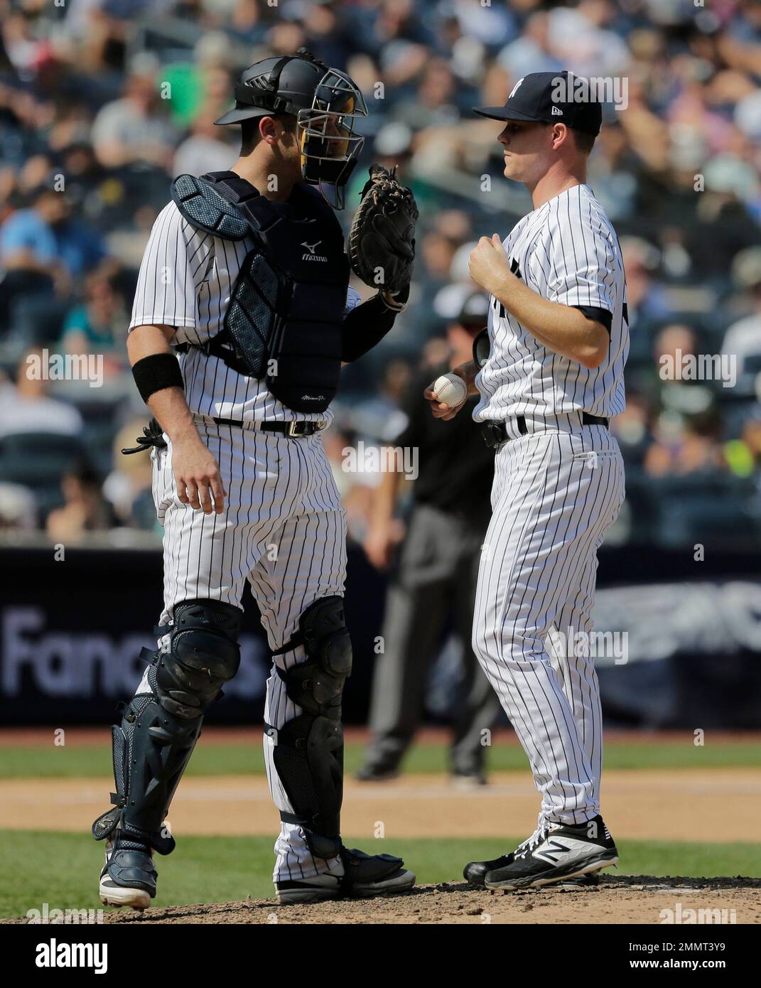 New York Yankees catcher Austin Romine, left, talks with pitcher Sonny ...