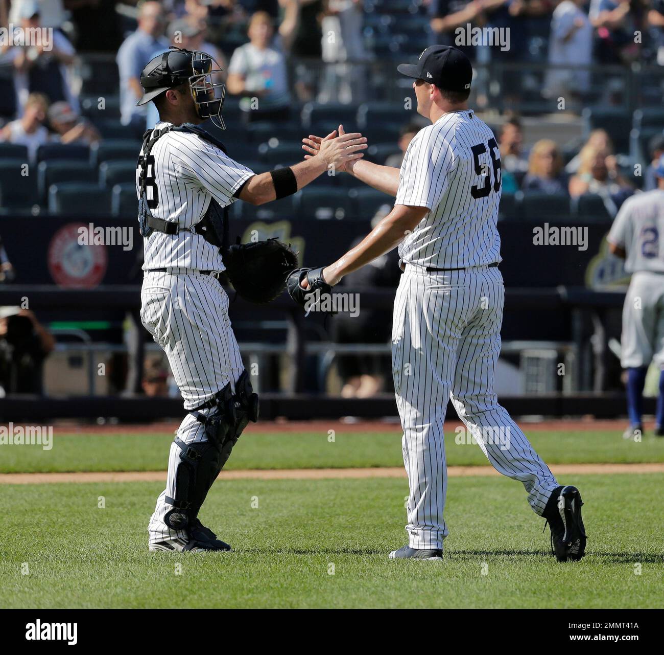 New York Yankees relief pitcher Jonathan Holder, right, and catcher ...