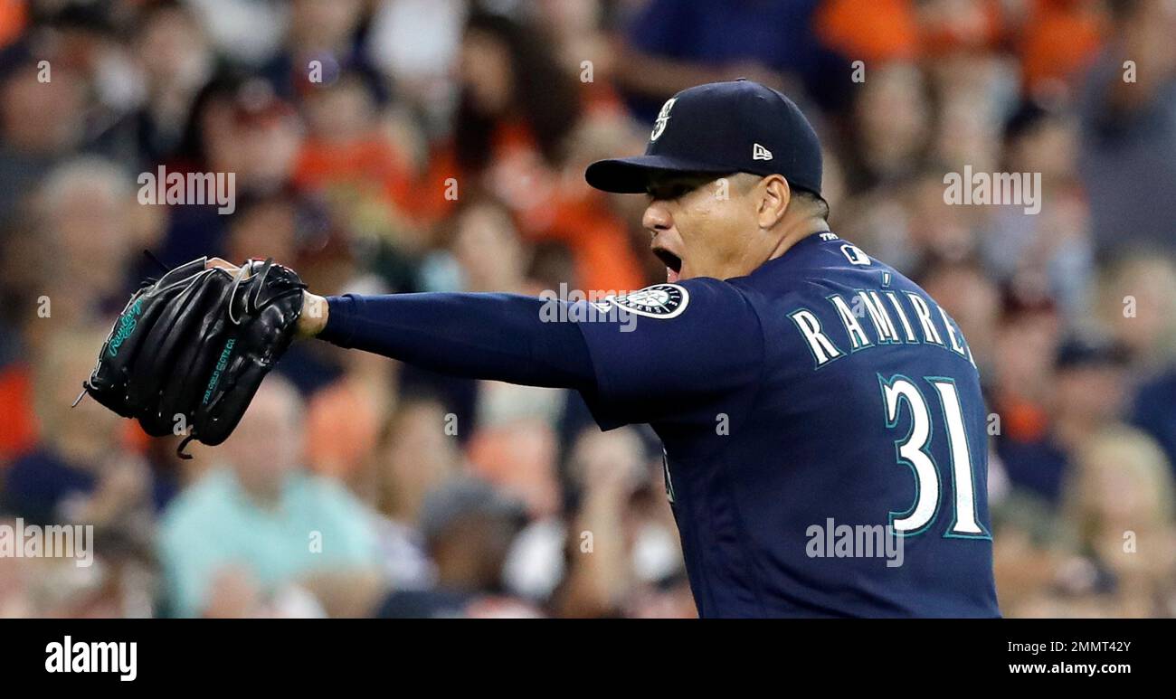 Seattle Mariners starting pitcher Erasmo Ramirez reacts after his team ...