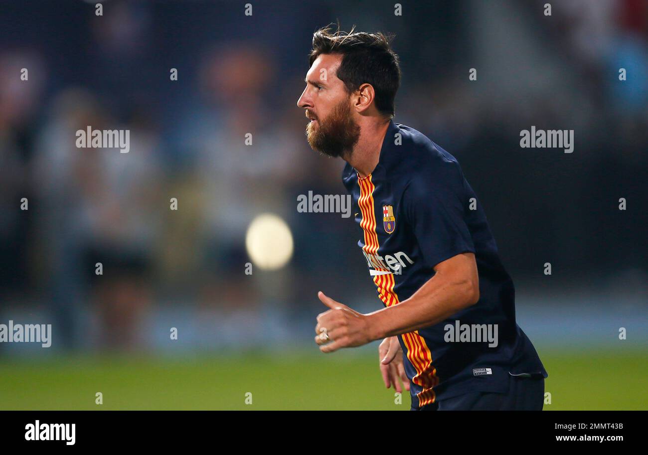 Barcelona's Lionel Messi exercises during warmup before the Spanish ...