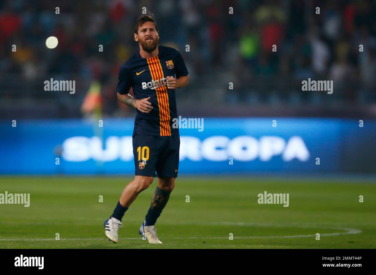 Barcelona's Lionel Messi exercises during warmup before the Spanish ...