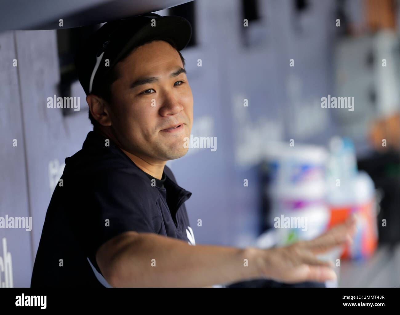 New York Yankees starting pitcher Masahiro Tanaka sits in the dugout ...
