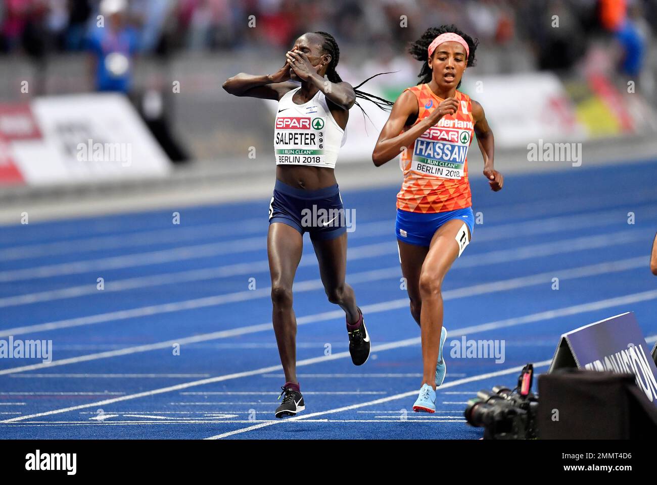 Israel's Lonah Chemtai Salpeter, left, reacts after stopping the race ...