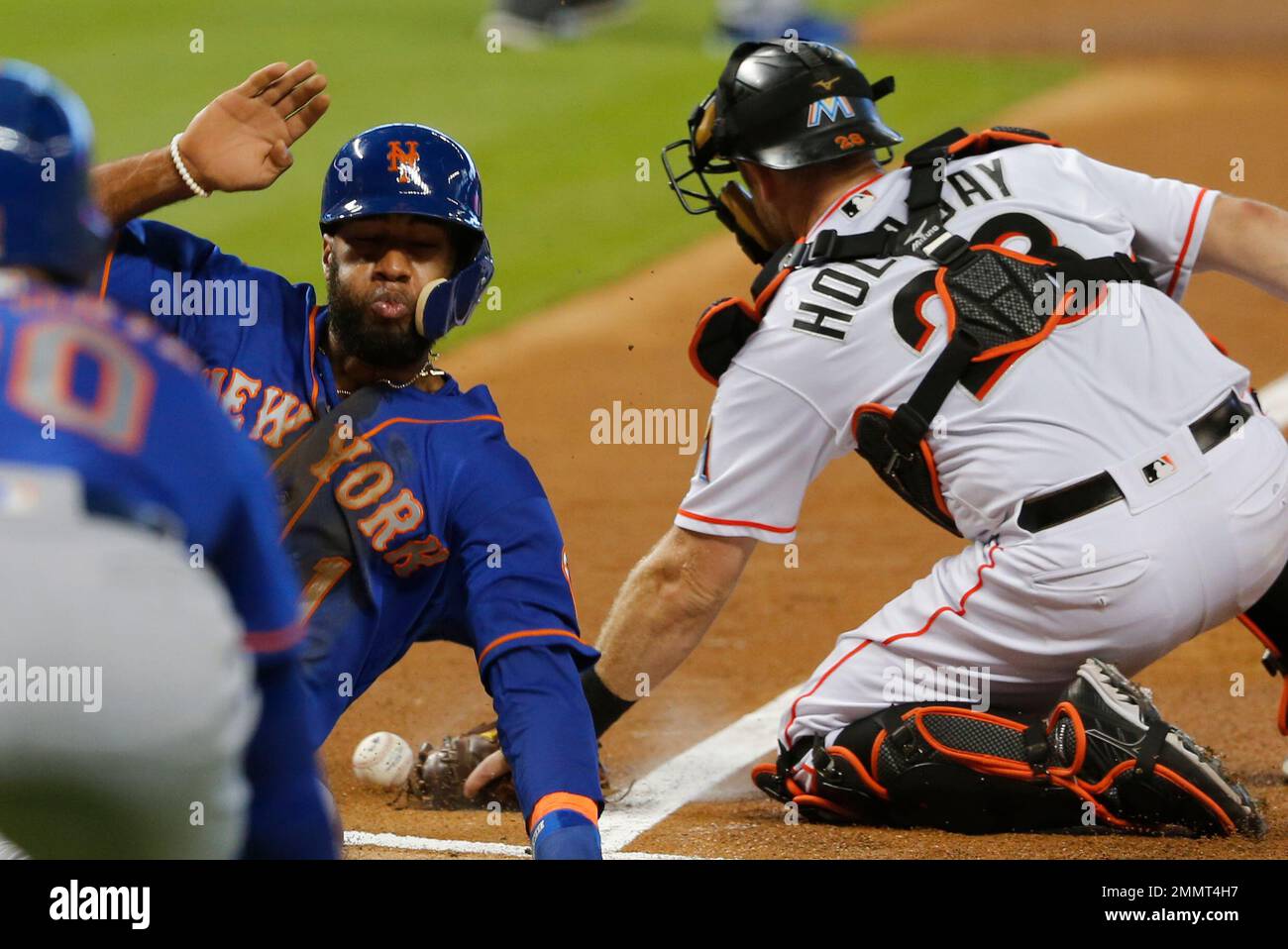 New York Mets baserunner Amed Rosario (1) scores as Miami Marlins ...