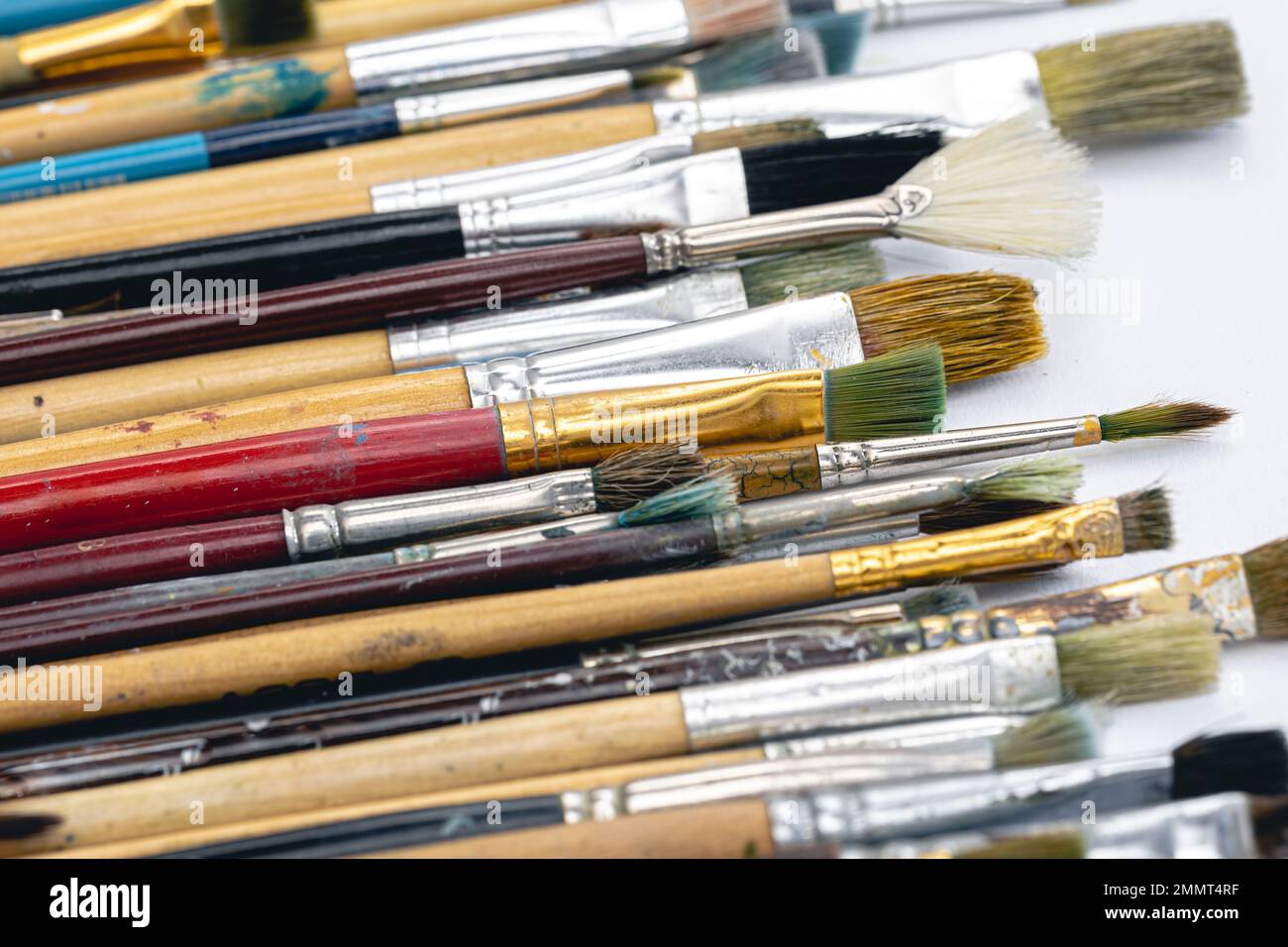 Close-up, old paint brushes on a white background Stock Photo - Alamy