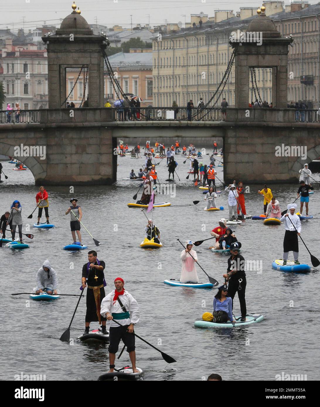 People steer their SUP-Boards along the Fontanka River during a SUP ...