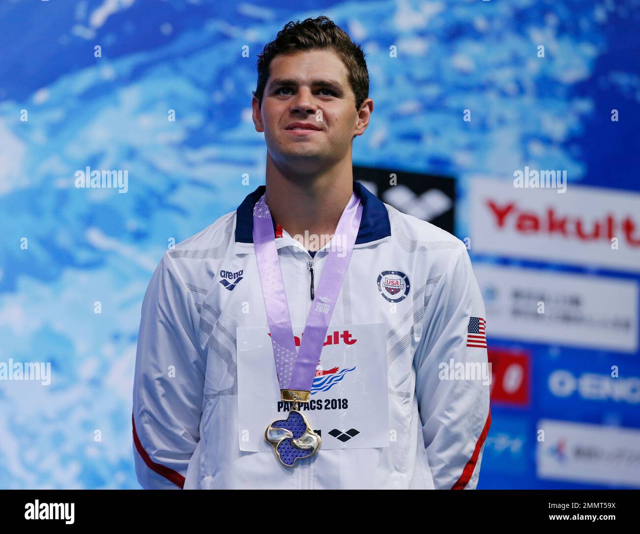 U.S. swimmer Michael Andrew celebrates on the podium after winning the ...