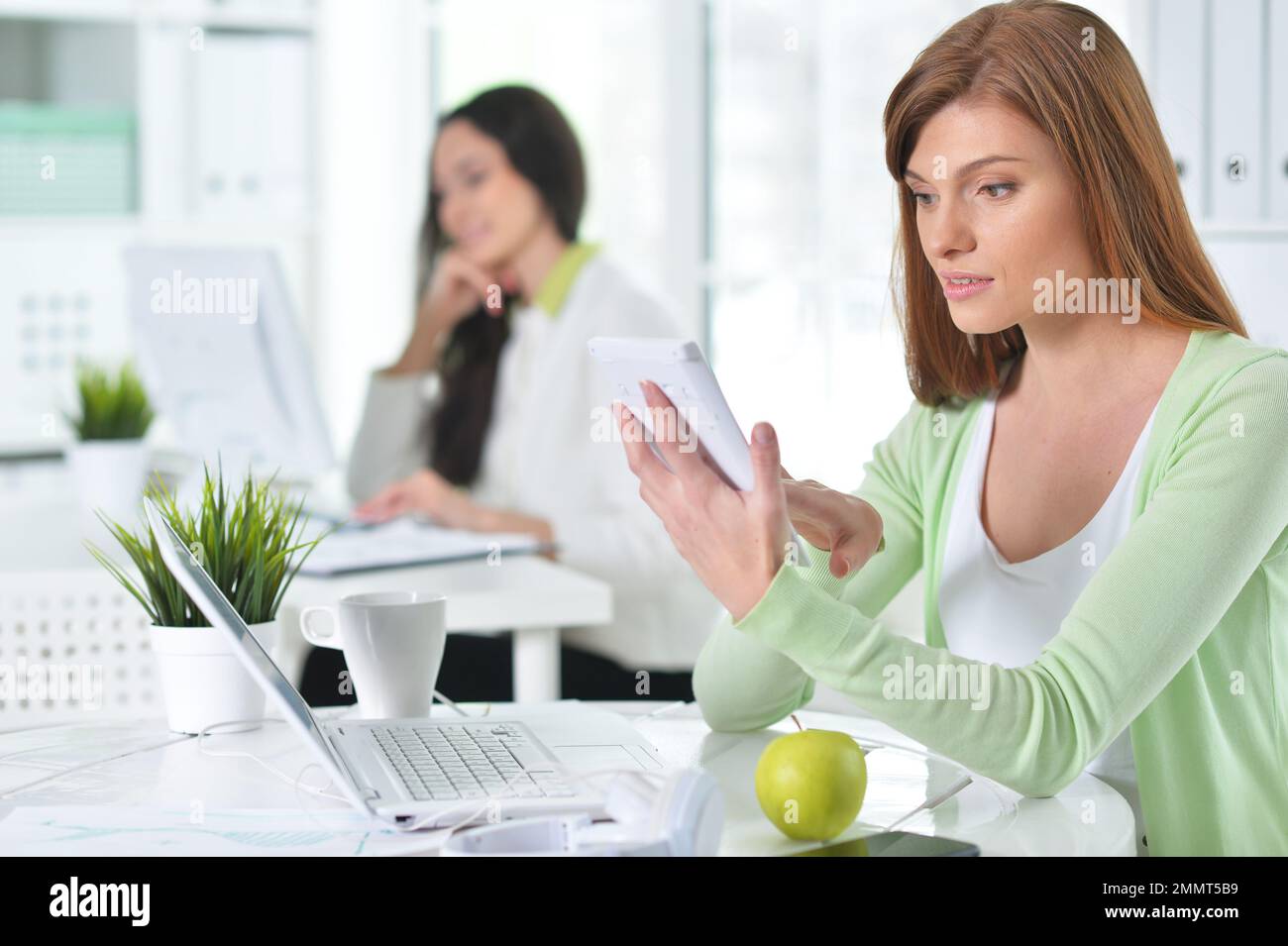 young women working in modern office Stock Photo - Alamy