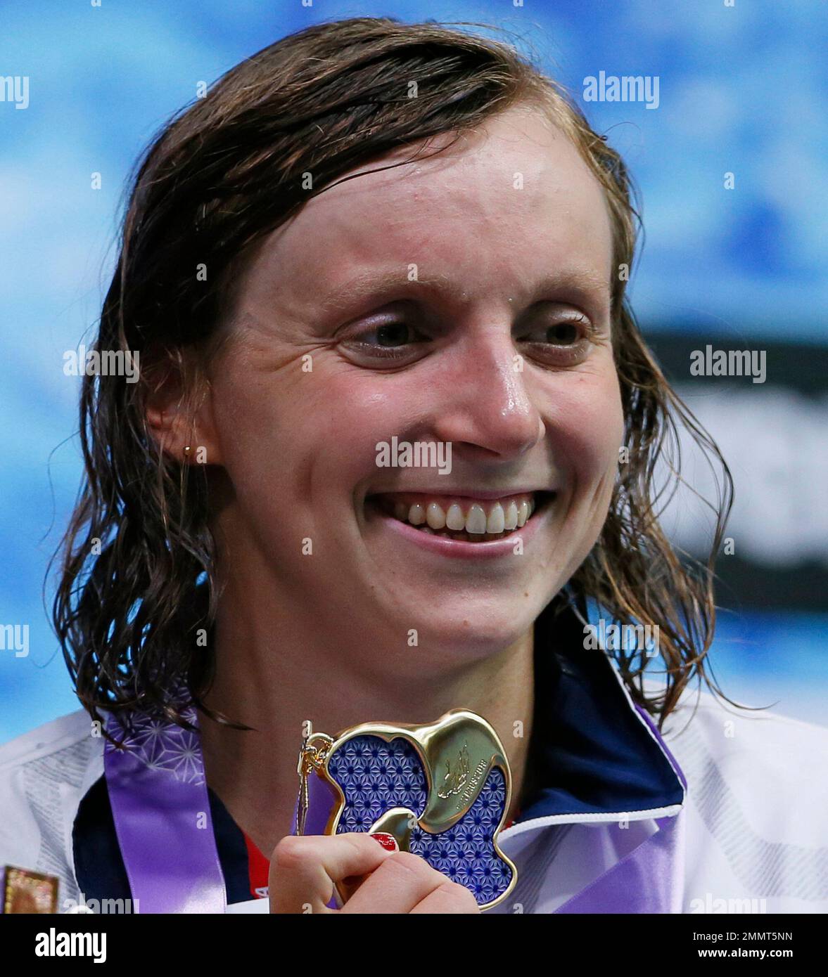 Katie Ledecky of the U.S., poses with her medal on the podium after ...