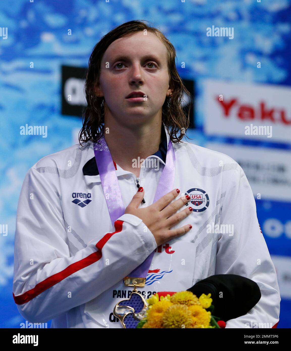 Katie Ledecky of the U.S., listens to the national anthem on the podium ...