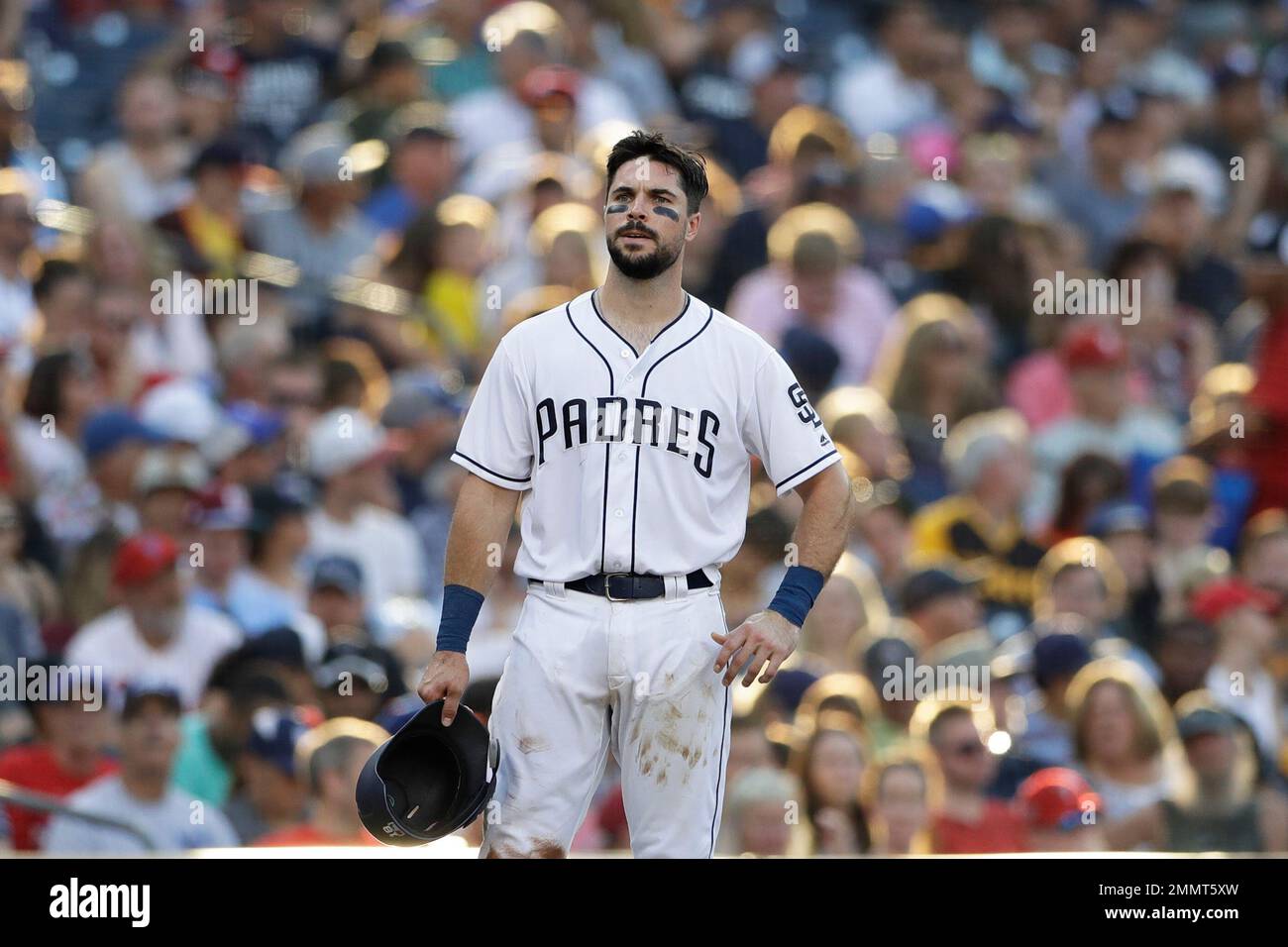 San Diego Padres' Austin Hedges looks on from third base after hitting ...