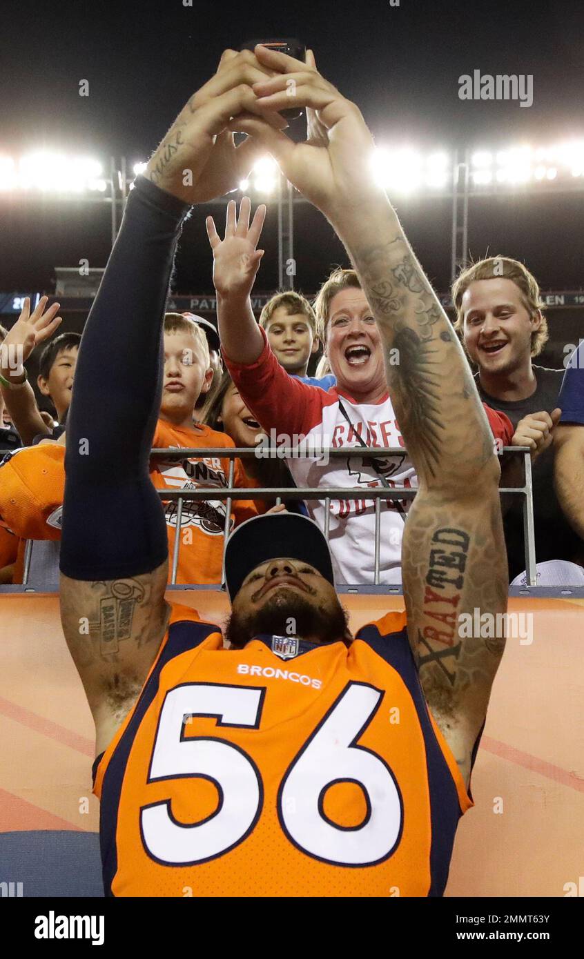 Denver Broncos linebacker Shane Ray takes a picture with fans after the ...