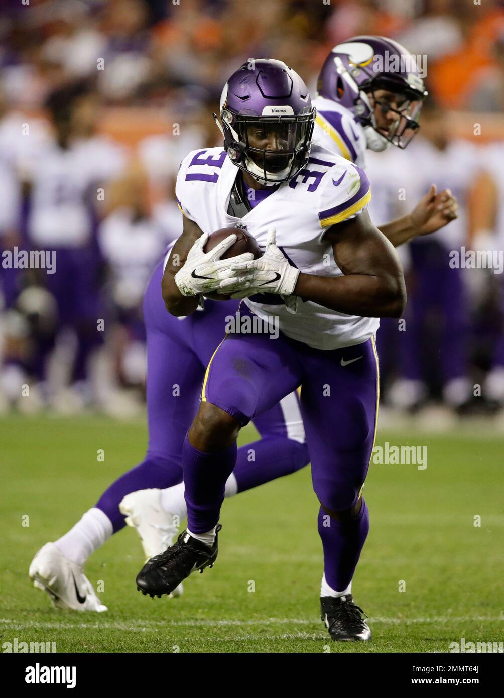 Minnesota Vikings running back Mack Brown runs against the Denver ...