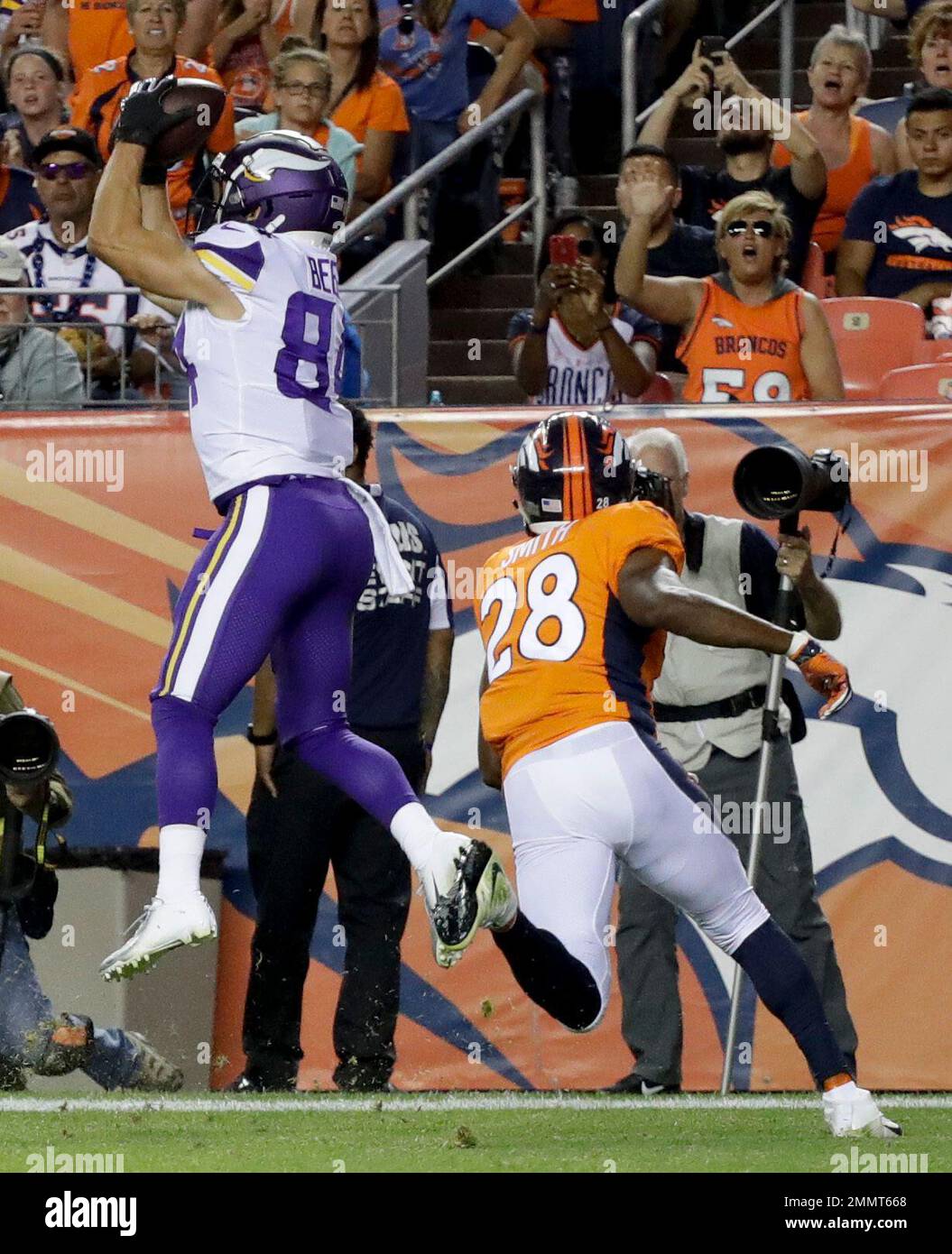 Minnesota Vikings wide receiver Chad Beebe, left, scores past Denver ...