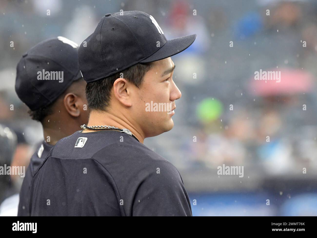 New York Yankees pitcher Masahiro Tanaka watches from the dugout as the Yankees and Texas ...