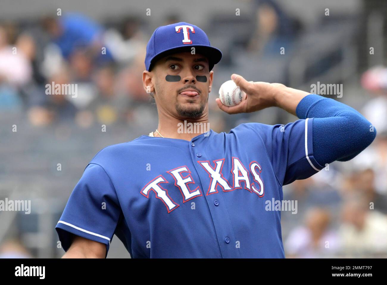 Texas Rangers first baseman Ronald Guzman warms up before a baseball ...