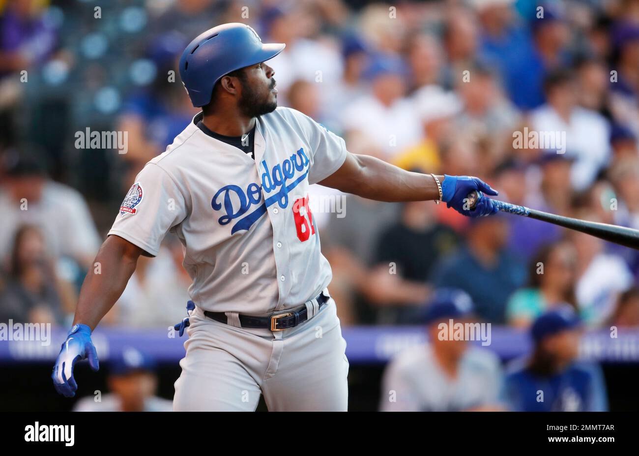 Los Angeles Dodgers' Yasiel Puig watches his solo home run off Colorado ...