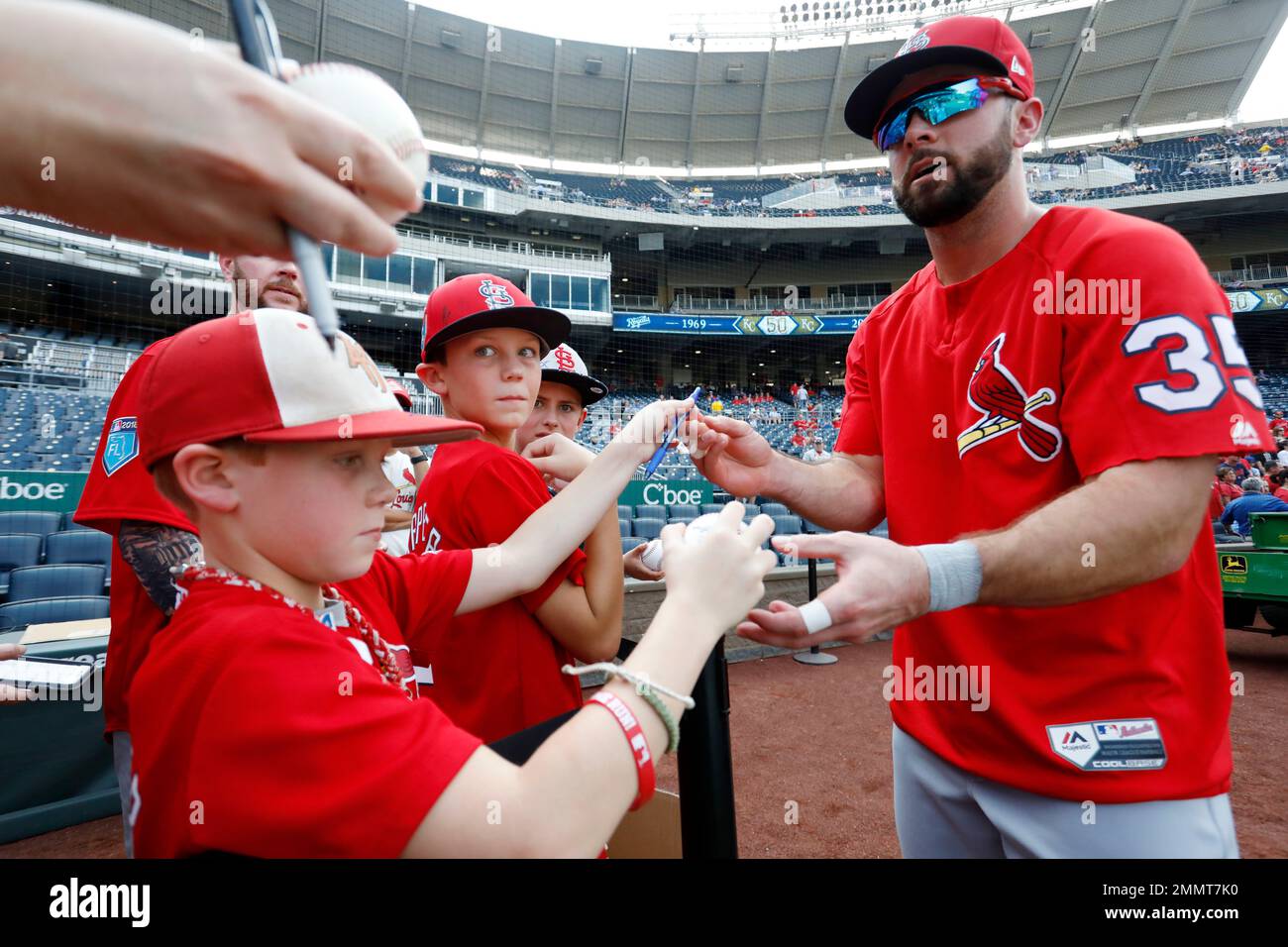 St. Louis Cardinals third baseman Greg Garcia signs autographs for fans ...