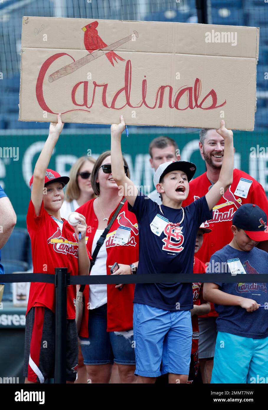 Young St. Louis Cardinals fans seek autographs during the team's ...