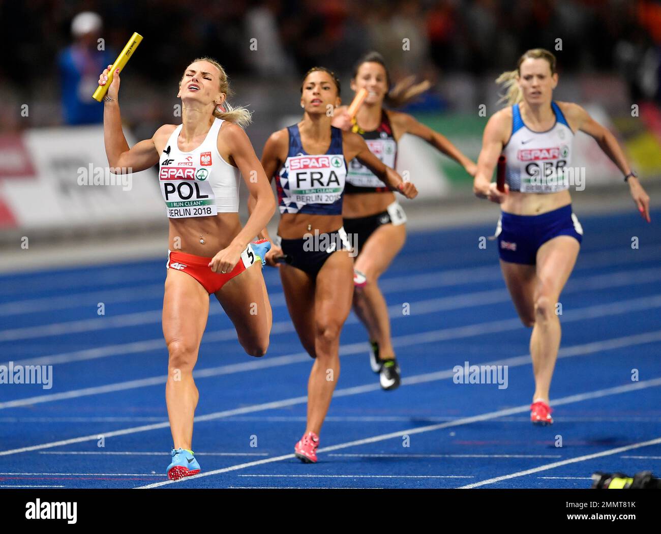 Poland's Justyna Swiety-Ersetic celebrates when crossing the line of ...