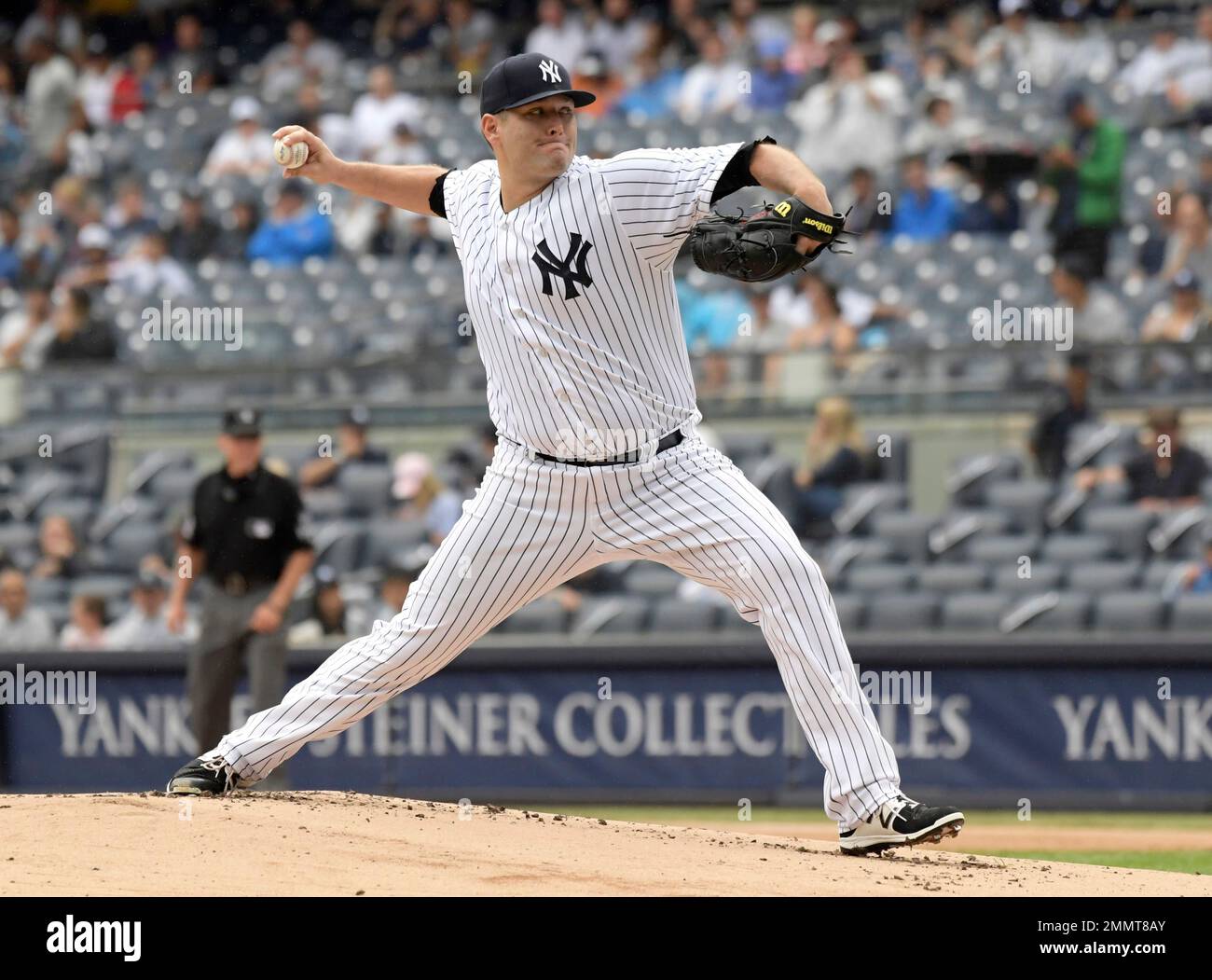 New York Yankees pitcher Lance Lynn delivers the ball to the Texas ...