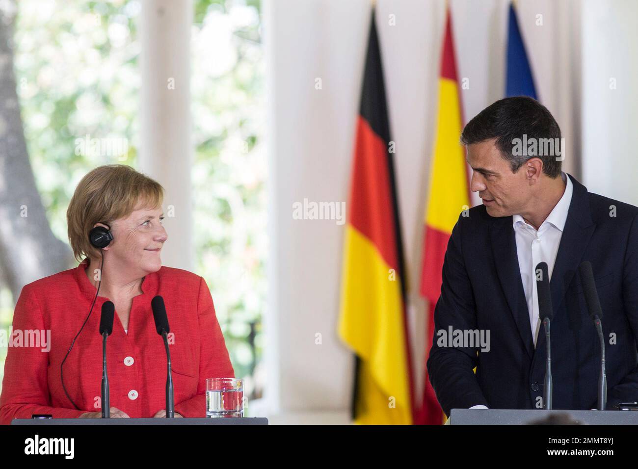 German Chancellor Angela Merkel, left and Spanish Prime Minister Pedro ...