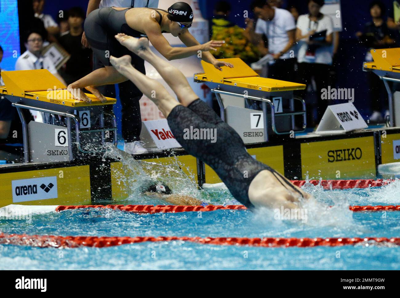 U.S. swimmer Margo Geer, center, and Japan's Mayuka Yamamoto, rear ...