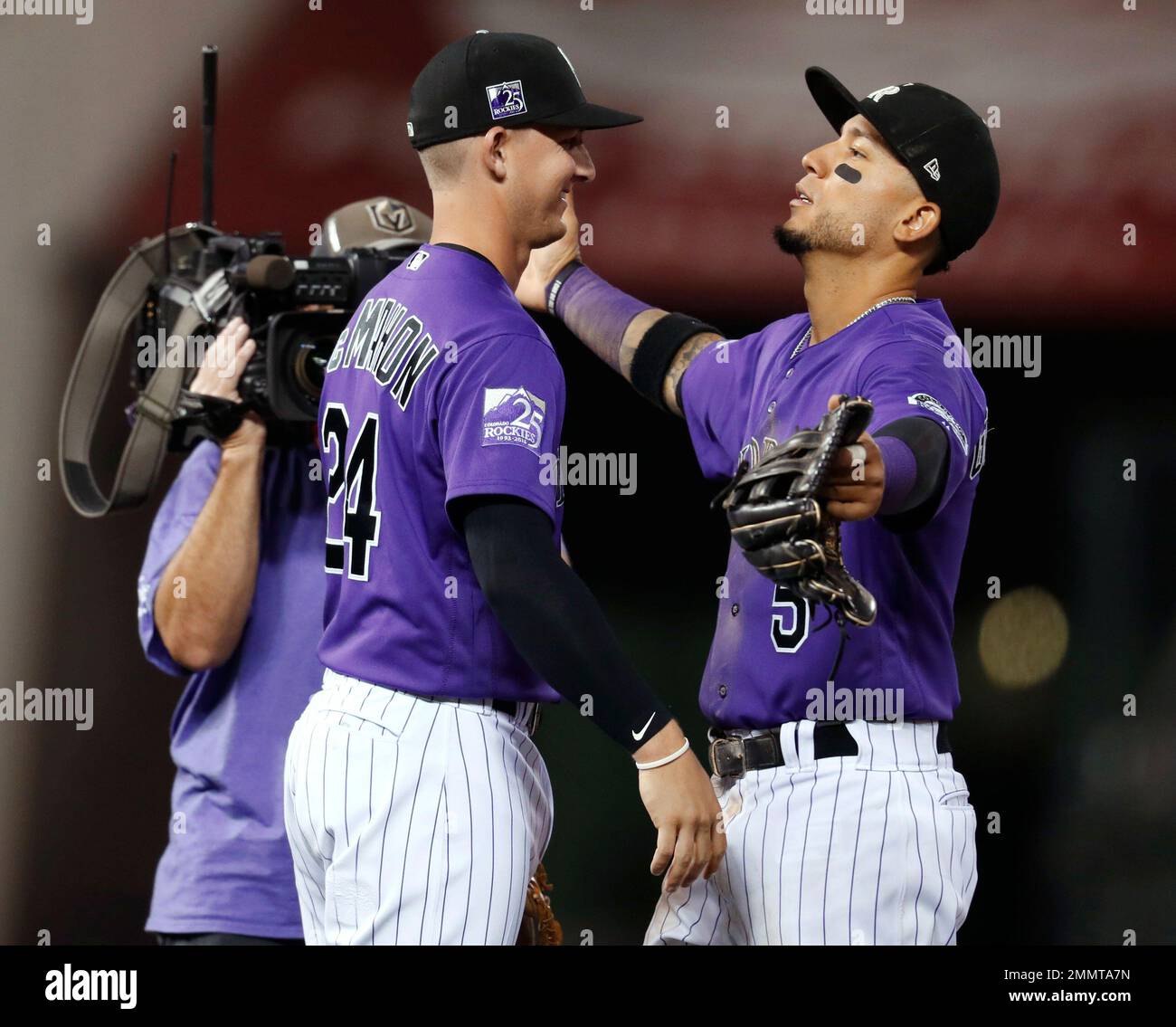 Colorado Rockies right fielder Carlos Gonzalez, right, prepares to ...