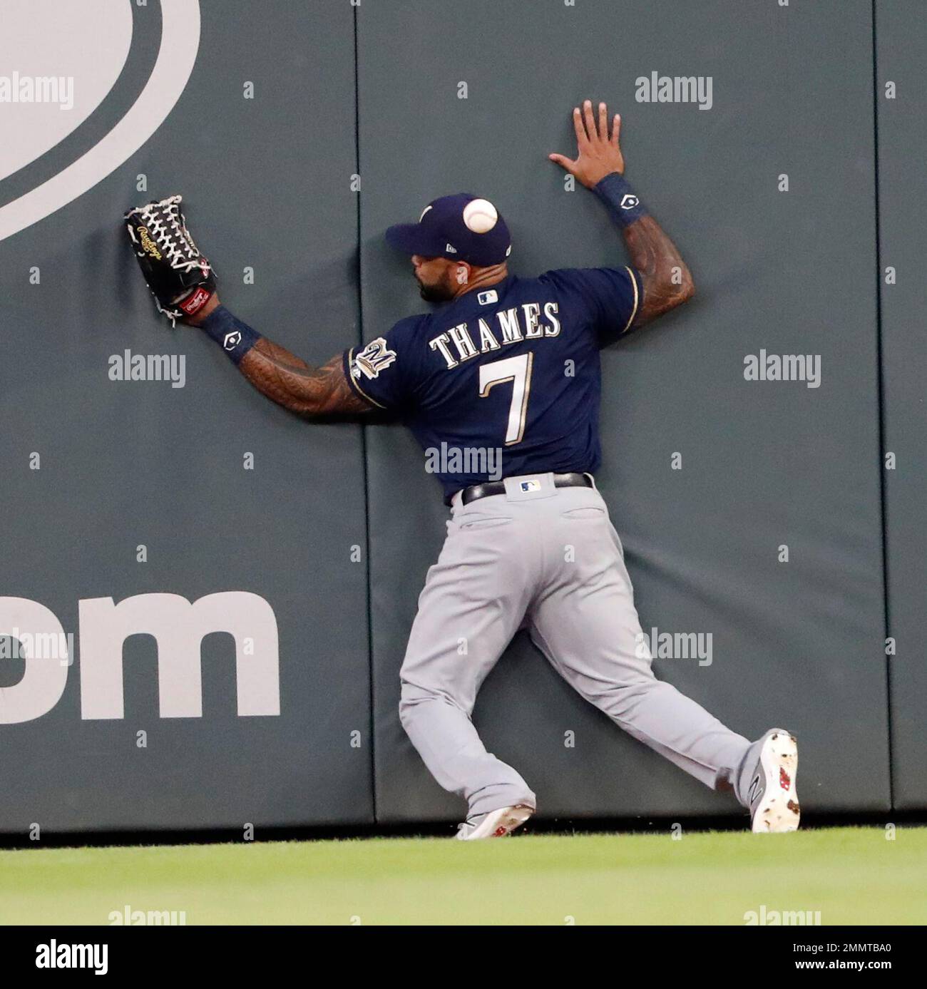 Milwaukee Brewers right fielder Eric Thames (7) cannot come up with a ...