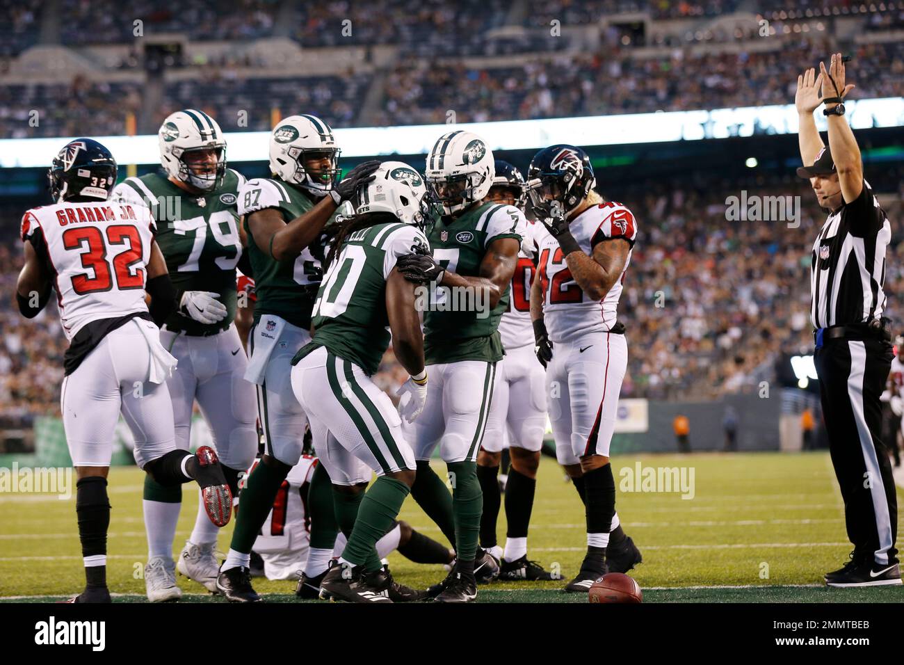 New York Jets' Isaiah Crowell (20) celebrates with teammates as Atlanta ...
