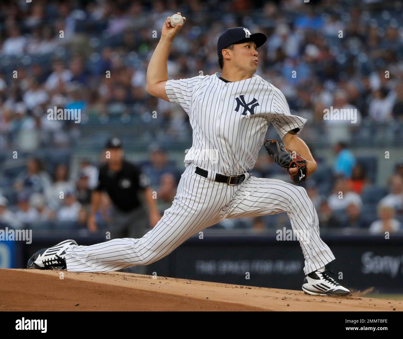 New York Yankees starting pitcher Masahiro Tanaka delivers to a Texas ...