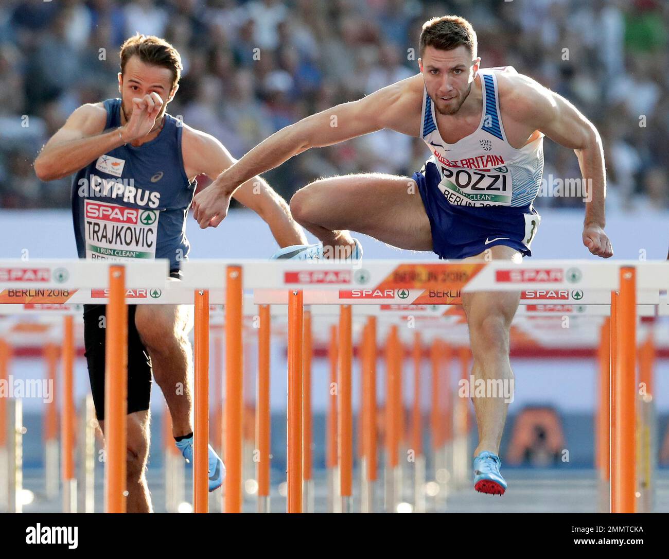 Milan Trajkovic from Cyprus, left, and Britain's Andy Pozzi, right ...