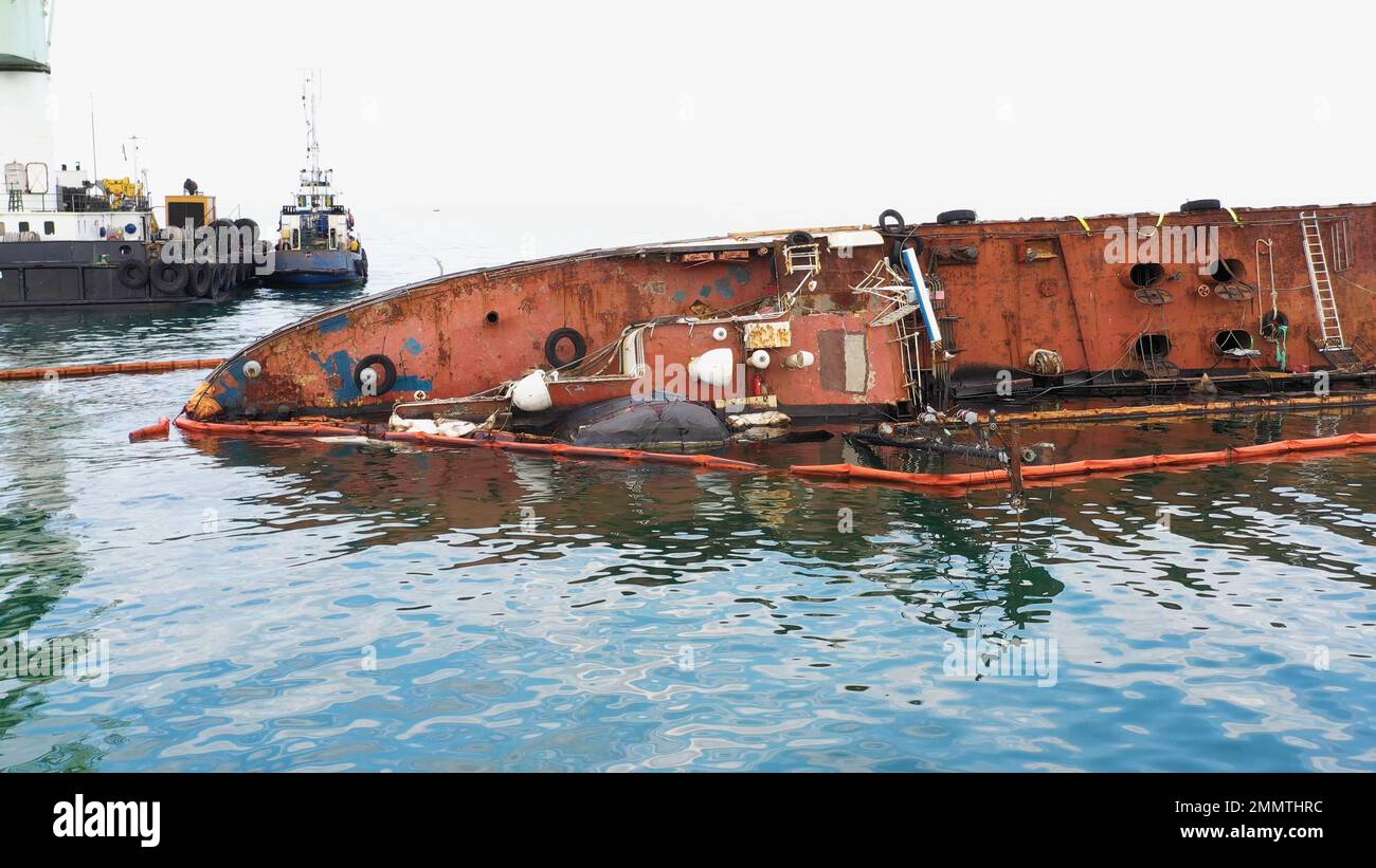 Close up of broken rusty oil tanker ship in the shallow water. Sunken ...