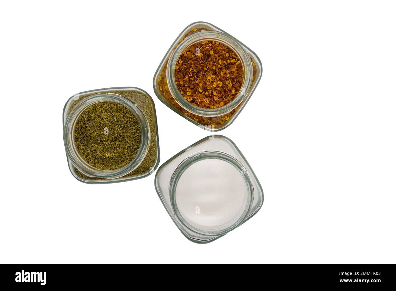 Three glass jars with spices, top view, isolated on white background ...