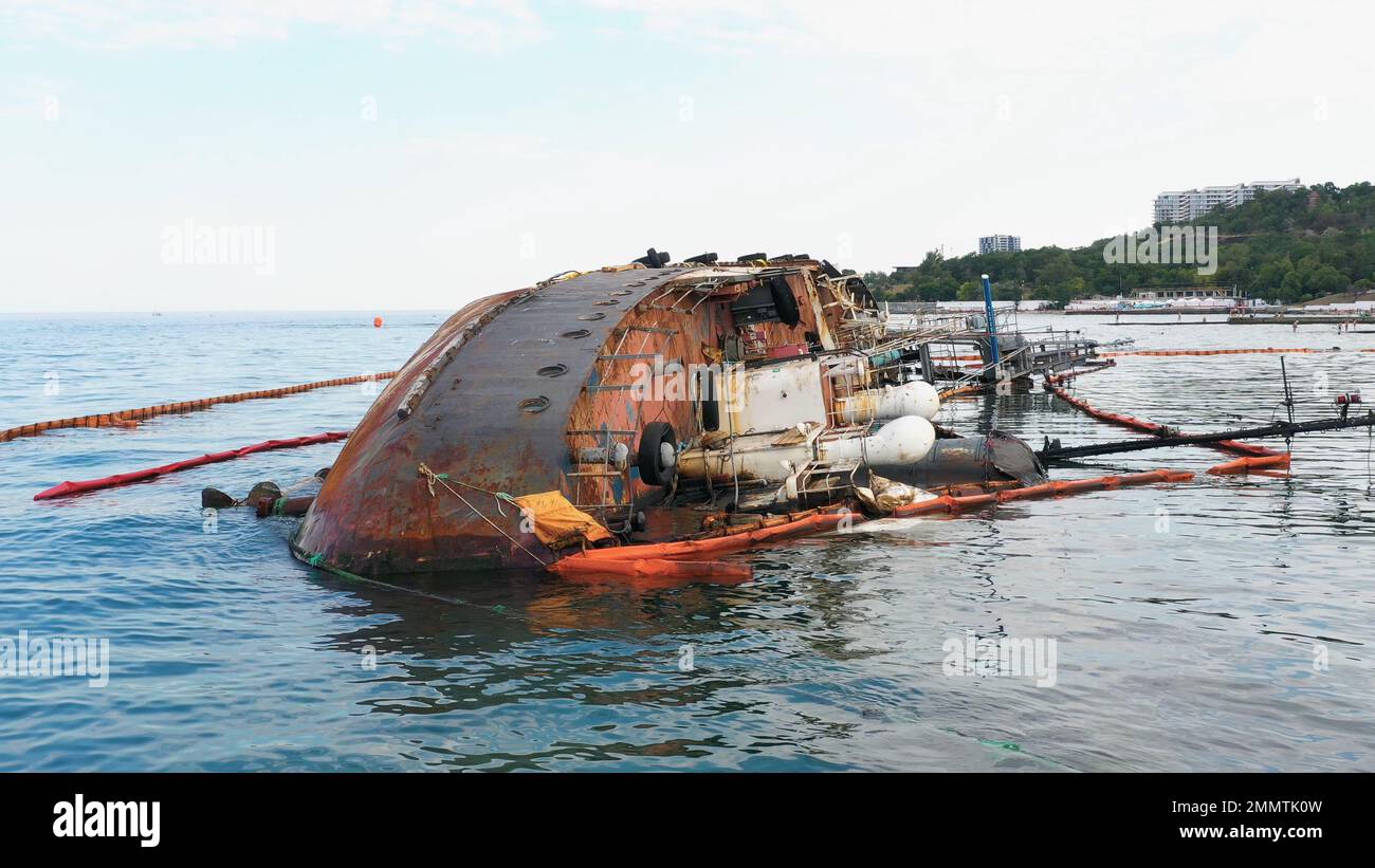 Broken rusty oil tanker ship in the shallow water after the wreck ...