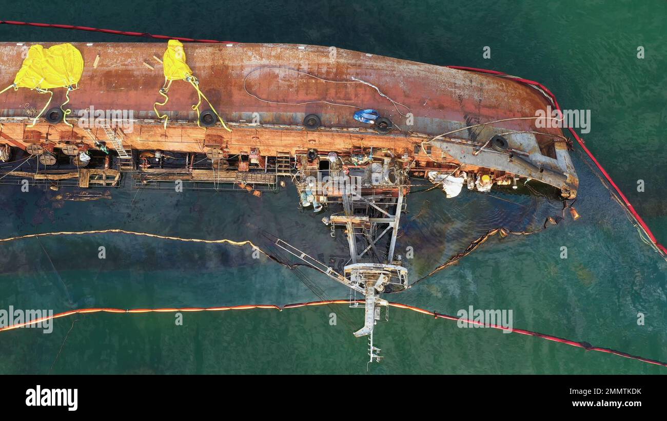 Aerial top view from drone of overturned broken rusty oil tanker ship ...