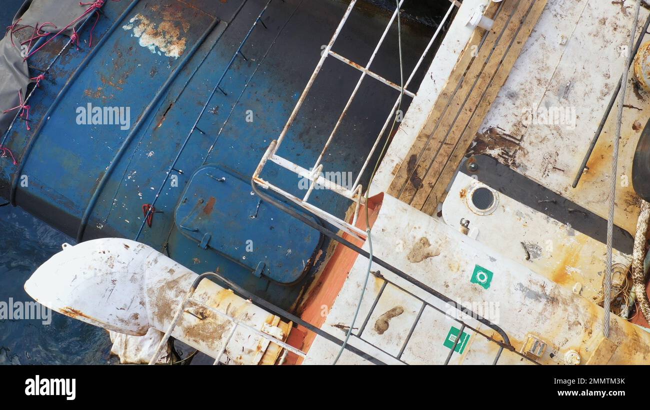 Close up top view of broken rusty oil tanker ship after the wreck ...