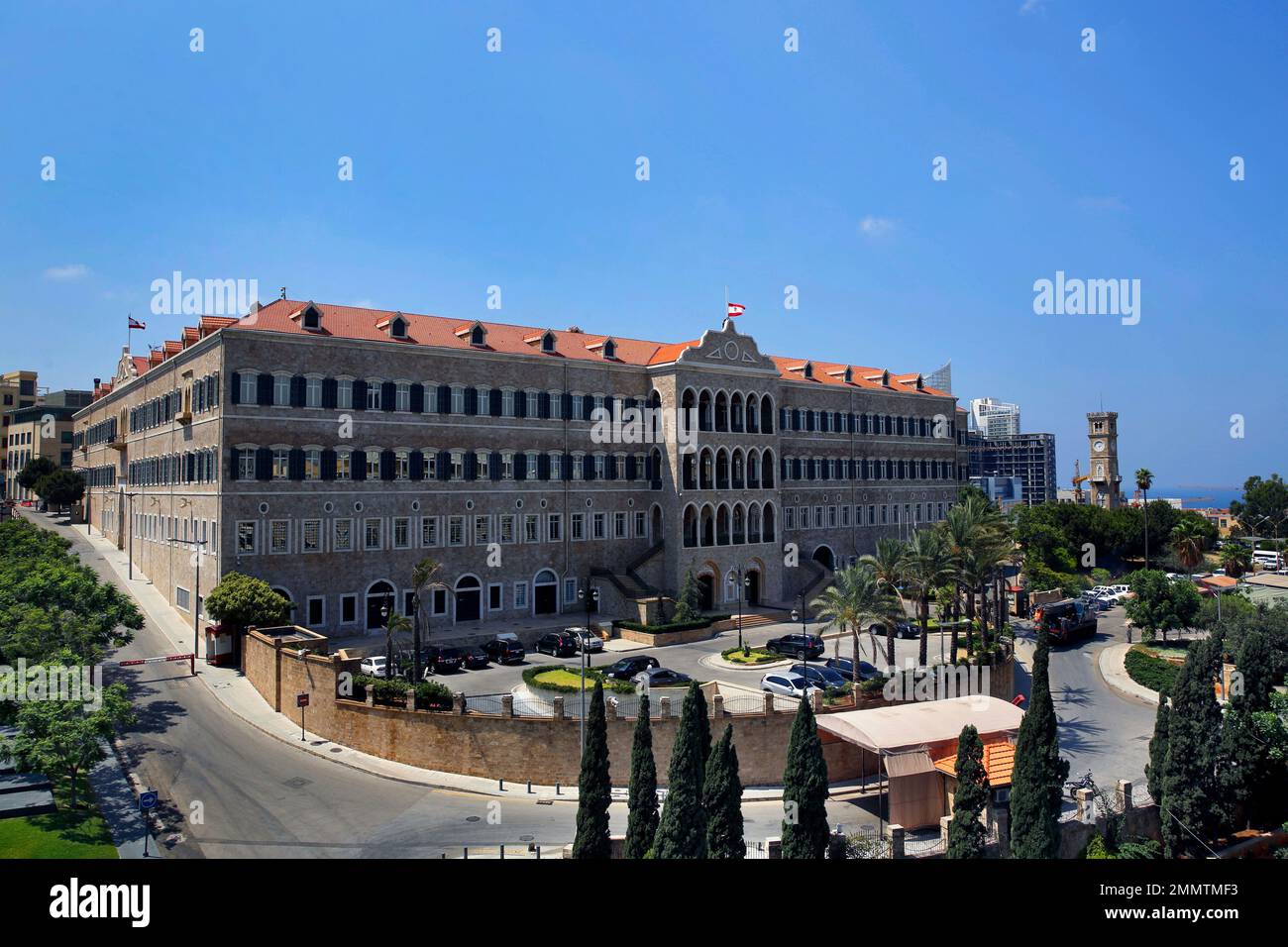 Workers replace the stand of the Lebanese flag on the government ...