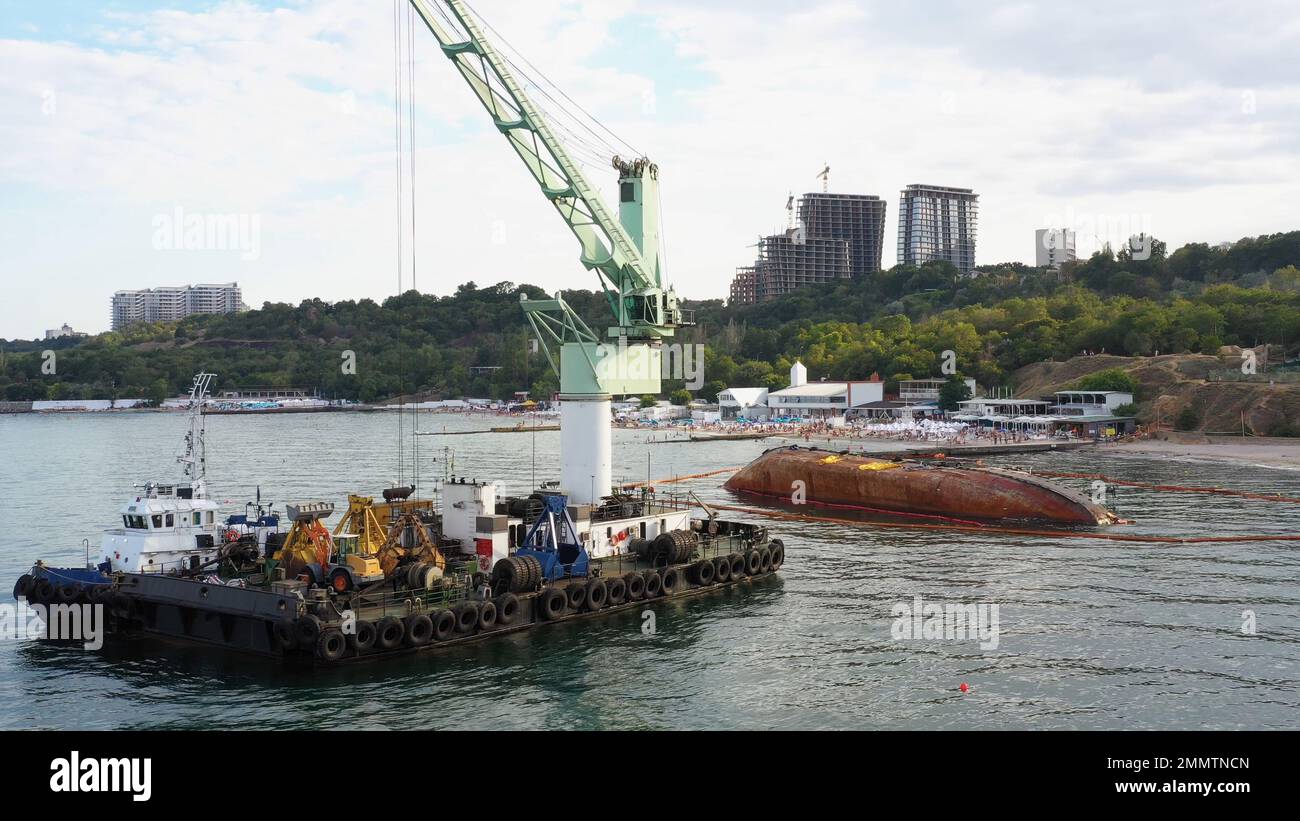Rescue wrecked oil tanker ship in Odessa. Old rusty ship lie on its ...