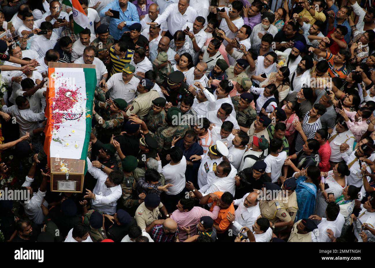 People carry the coffin containing the body of Indian Army Major ...