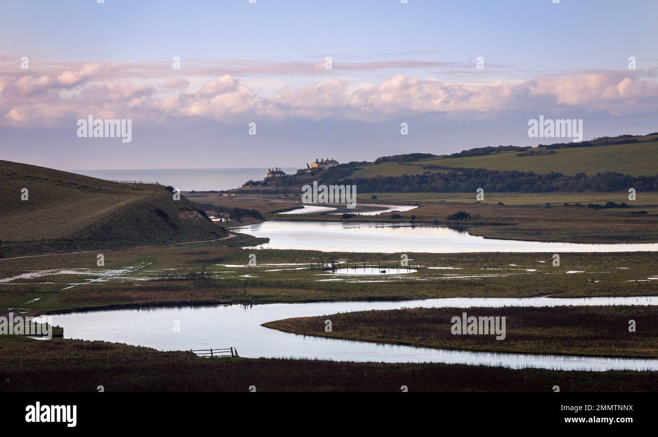 The meandering Cuckmere river winding its way down to the coast within ...
