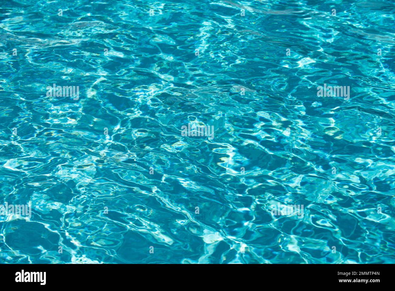 Background of blue water in swimming pool with sun reflection, ripple ...