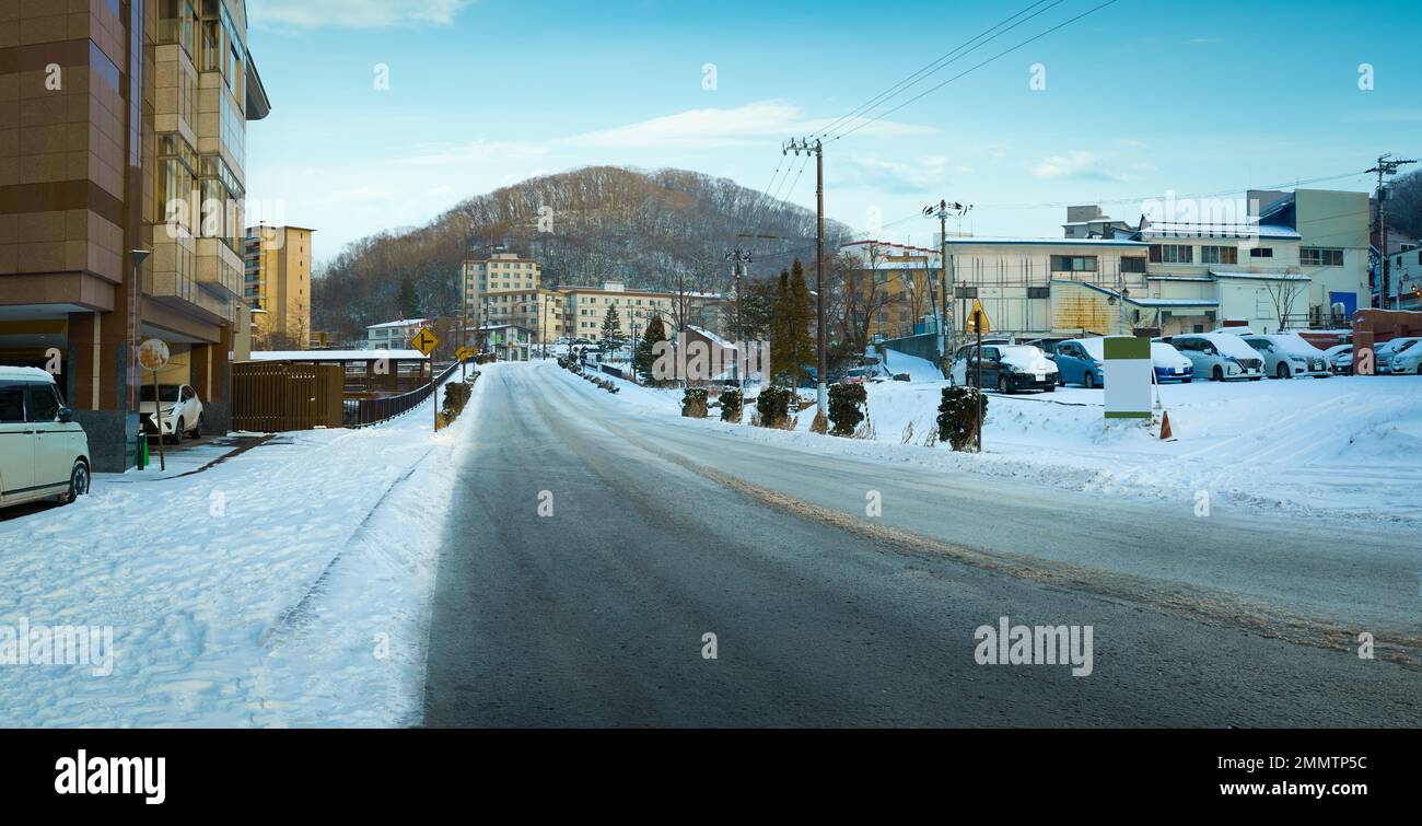 Empty asphalt road with beautiful winter small town Stock Photo - Alamy