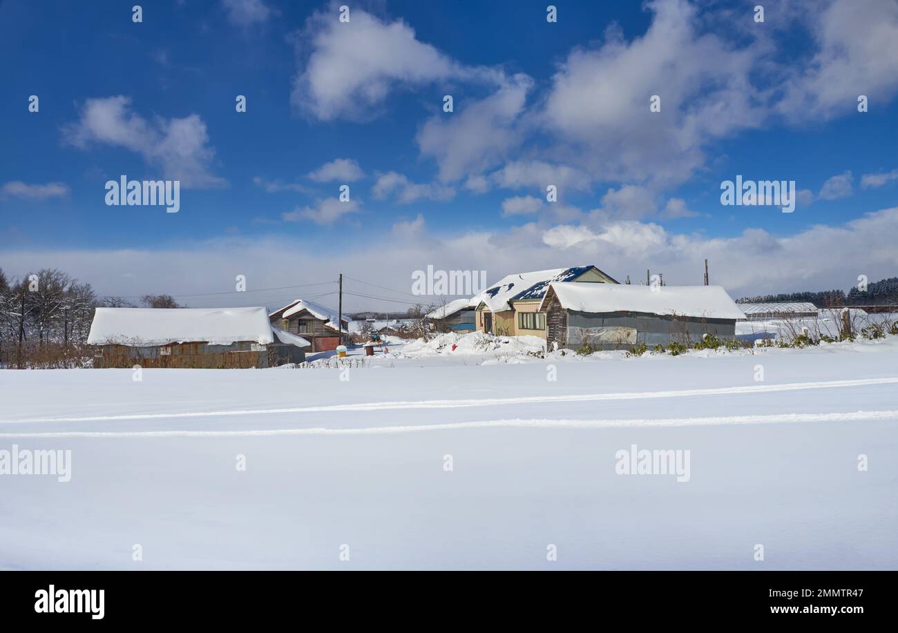 Empty snow-covered ground with beautiful winter small town Stock Photo ...