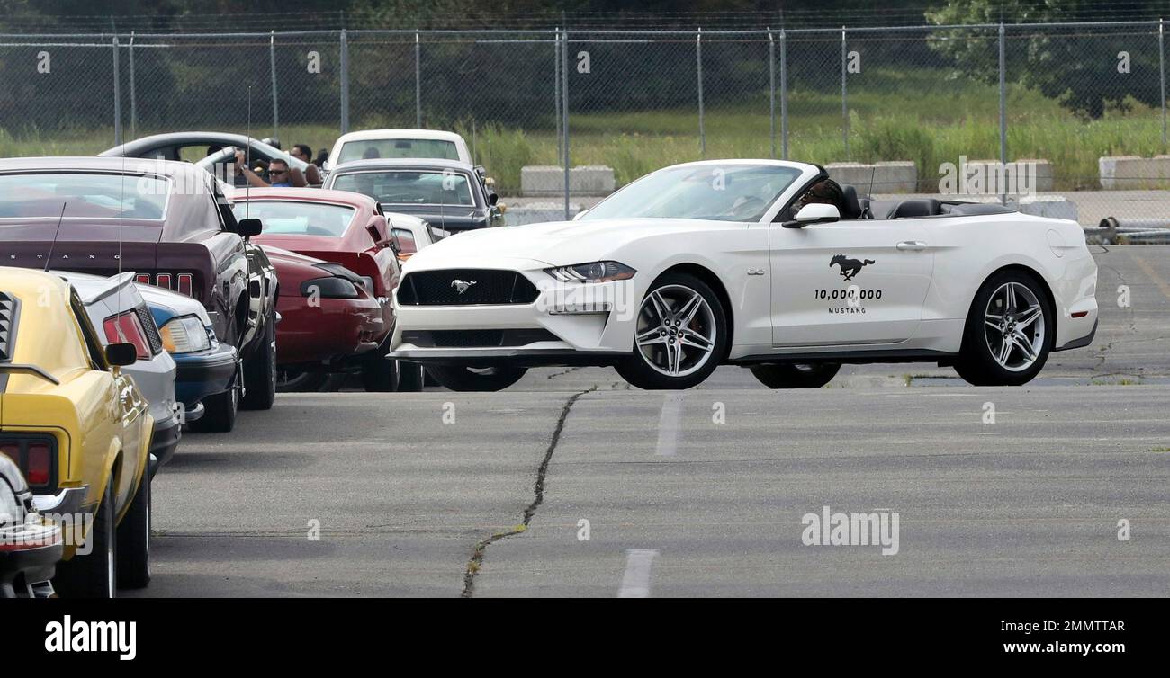 A 2019 GT Mustang, the 10 millionth Mustang built by Ford drives by a ...