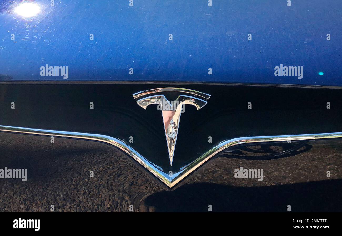 In this July 13, 2018 photo, the front hood emblem of a Tesla Model X ...
