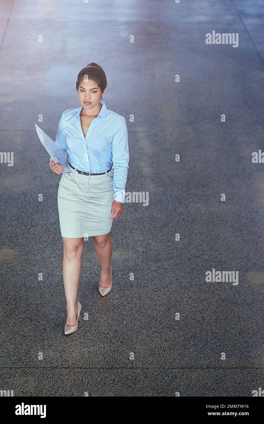 She walks the walk and talks the talk. High angle shot of a confident ...